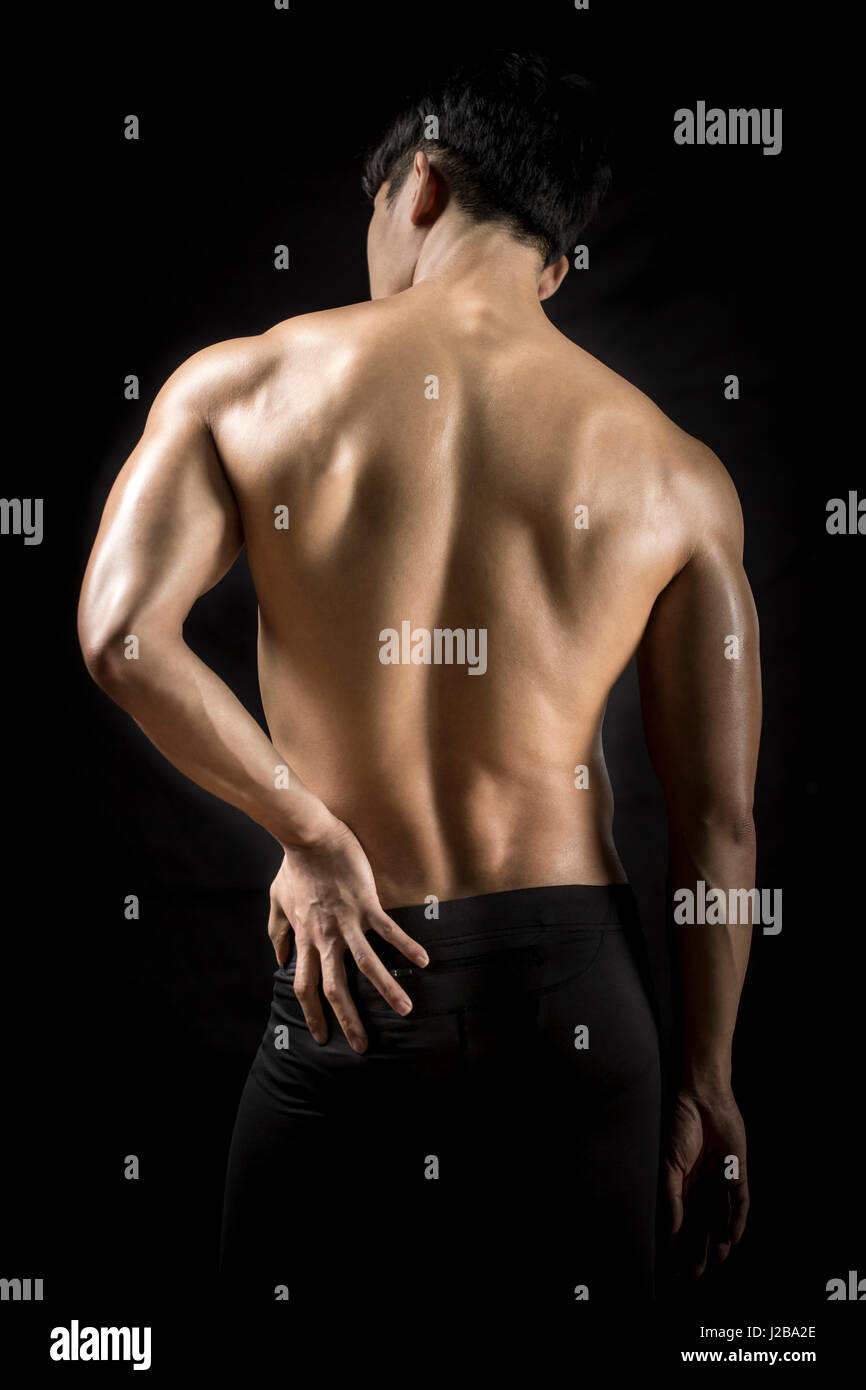 Back of young healthy muscular man Stock Photo - Alamy