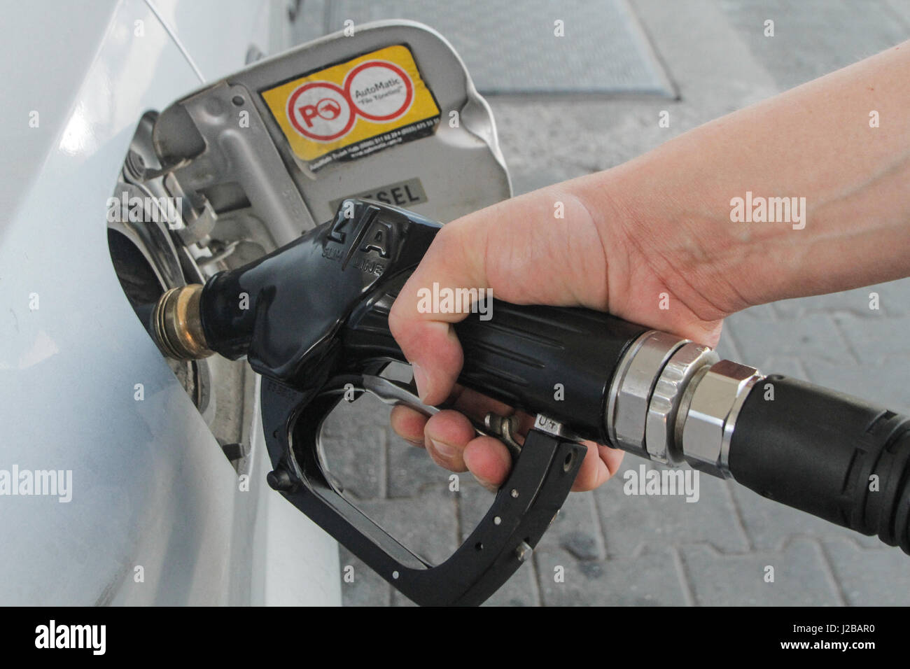 BUCHAREST, ROMANIA, June 5, 2016: Close-up of a man's hand using a ...
