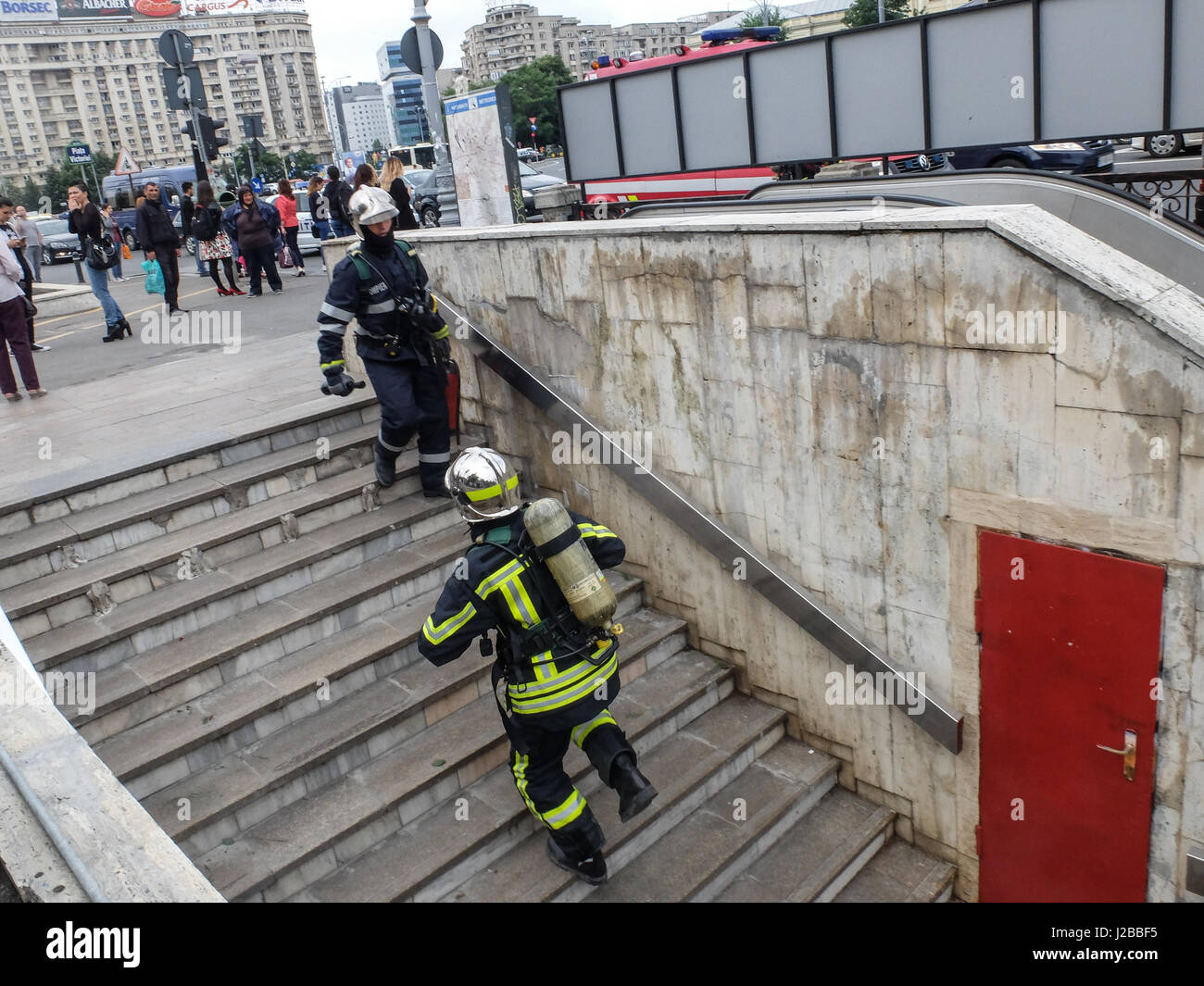 BUCHAREST, ROMANIA, June 14, 2016: Fire fighters taking control of a ...