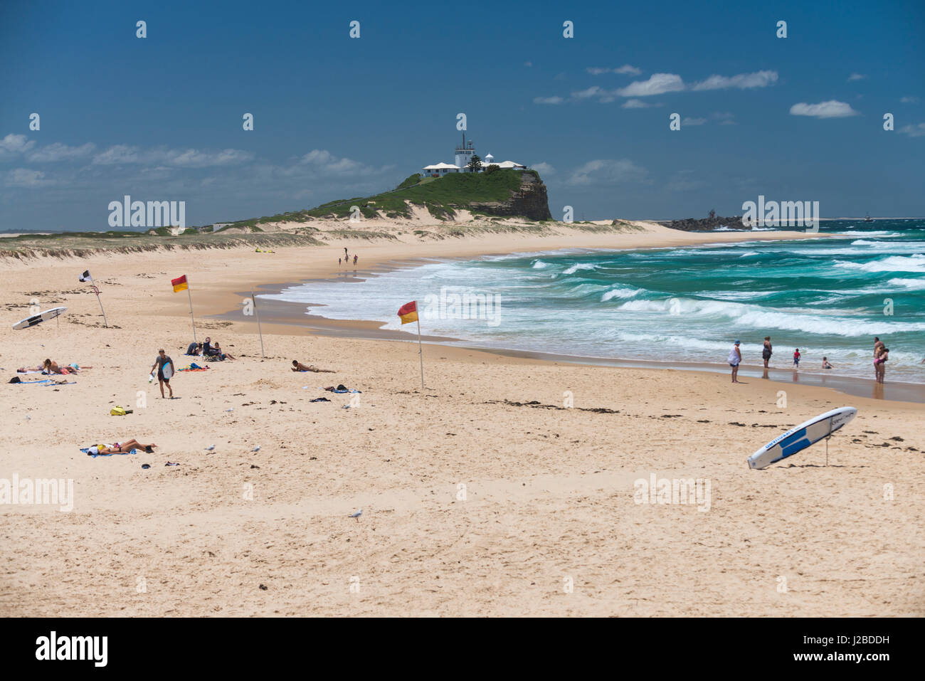 Surfers and holiday makers on Nobbys Beach, Newcastle, NSW, Australia ...