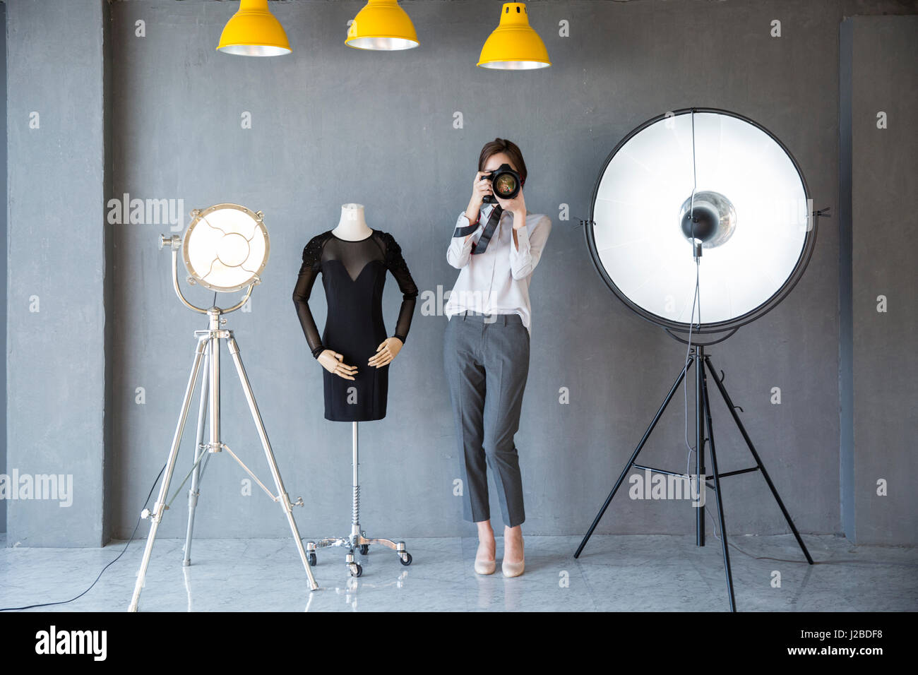 Female photographer at studio Stock Photo - Alamy
