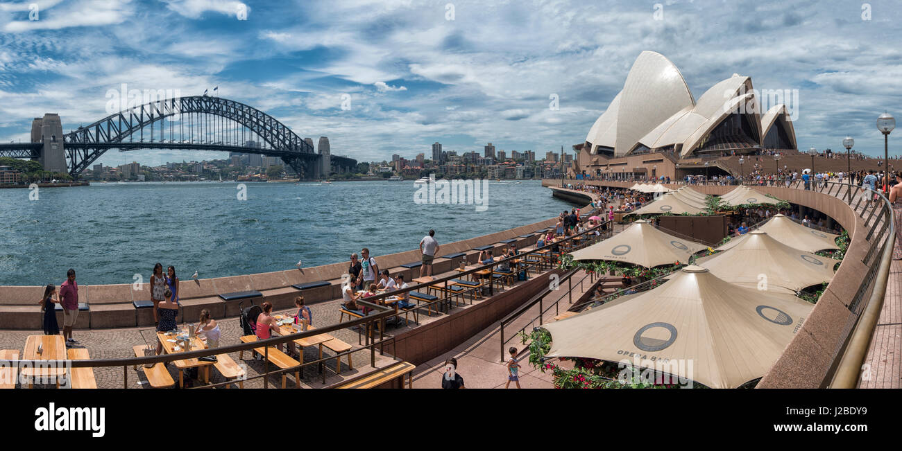 A panoramic view of Sydney's iconic Harbour Bridge and Opera House with ...