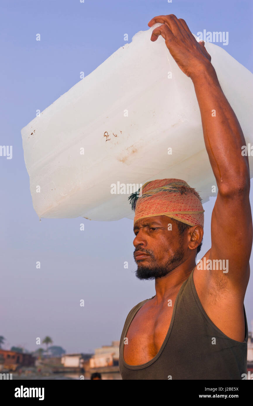 Man transporting big ice block on his head, Barisal, Bangladesh, Asia ...