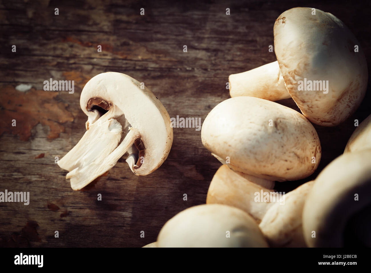 champignons on a wooden background in garden Stock Photo - Alamy