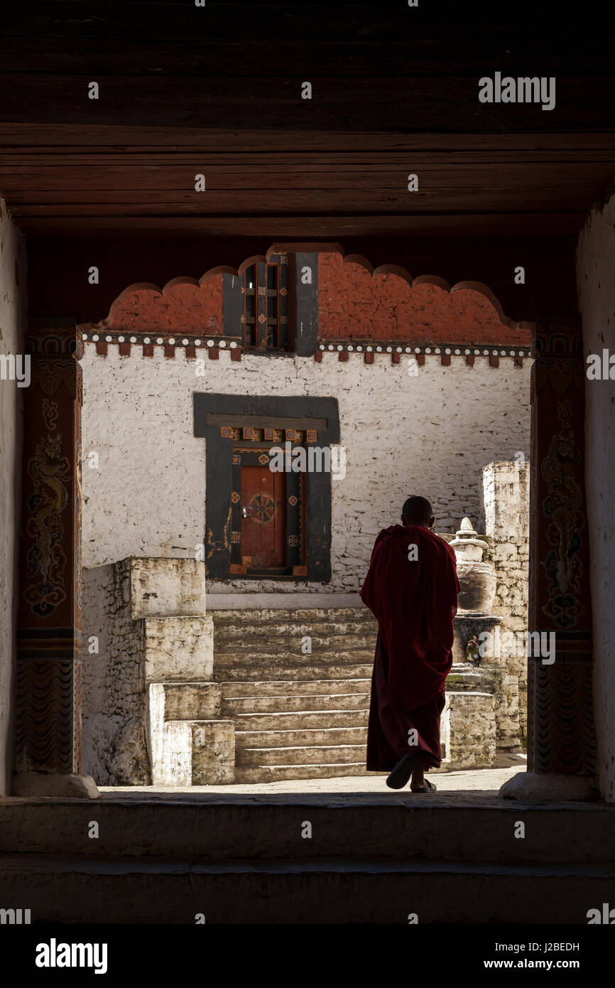 Bhutan, Monk walks through doorway of monastery, Bhutan Stock Photo - Alamy