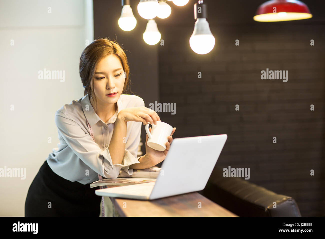 Female designer thinking Stock Photo - Alamy