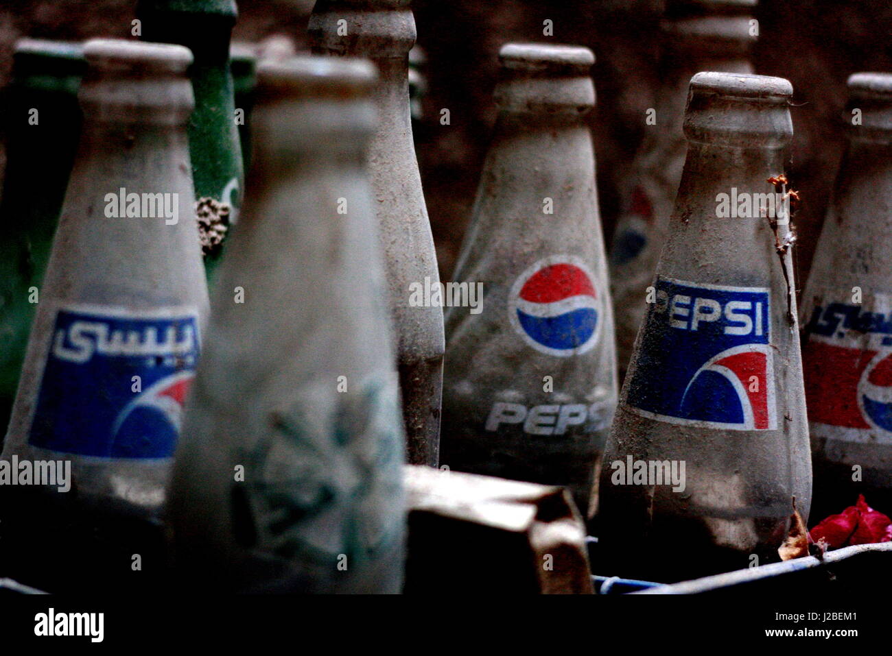 Empty dusty Pepsi Cola bottles in a street in downtown Cairo, Egypt ...