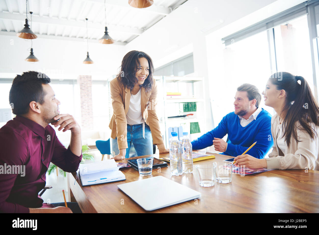 Female manager with business team Stock Photo - Alamy