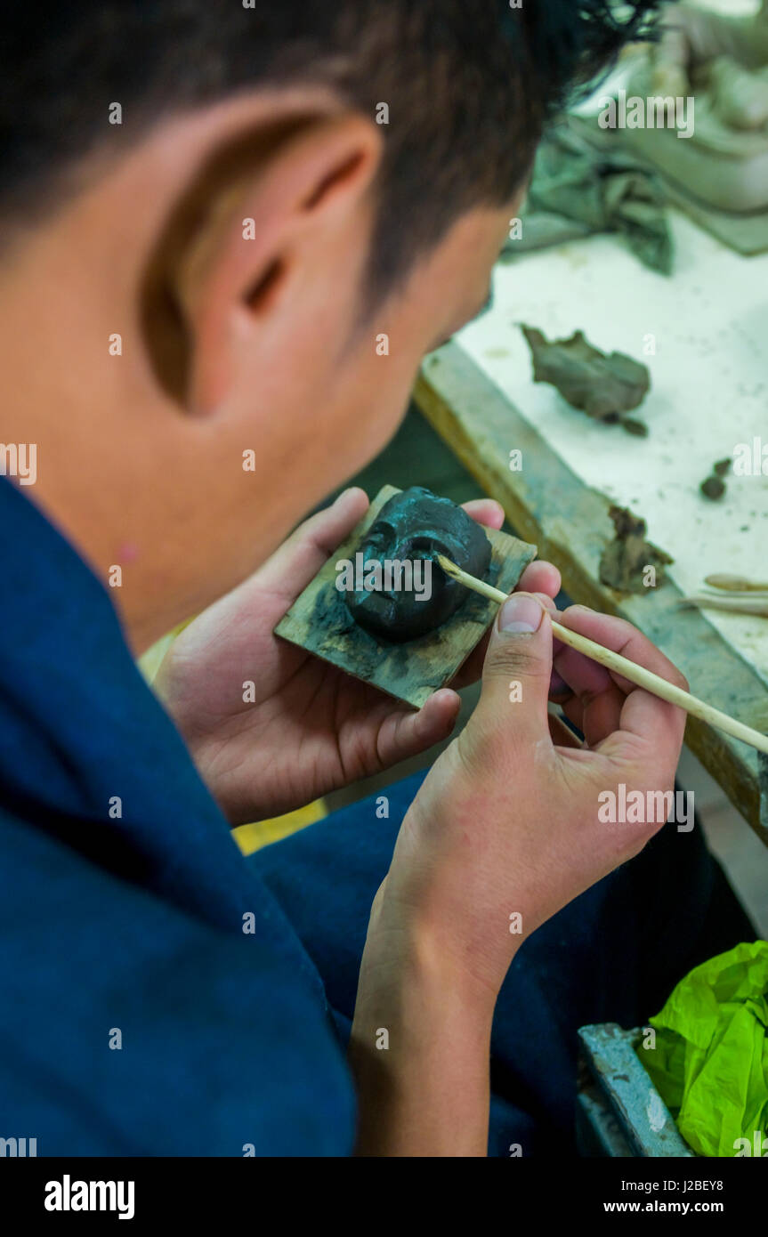 Man modeling with clay, Thimphu, Bhutan Stock Photo - Alamy