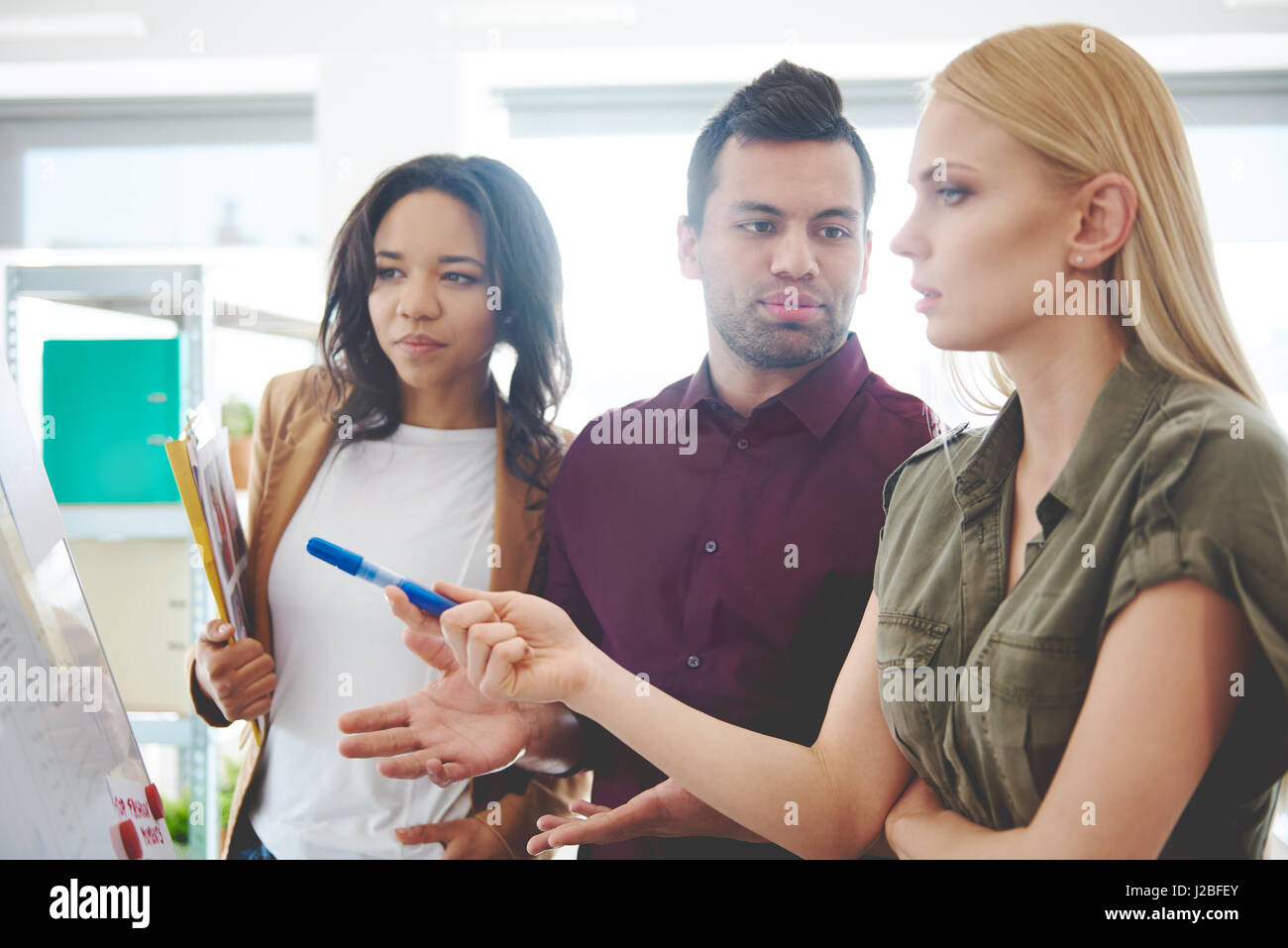Talented group of young people doing analysis Stock Photo - Alamy
