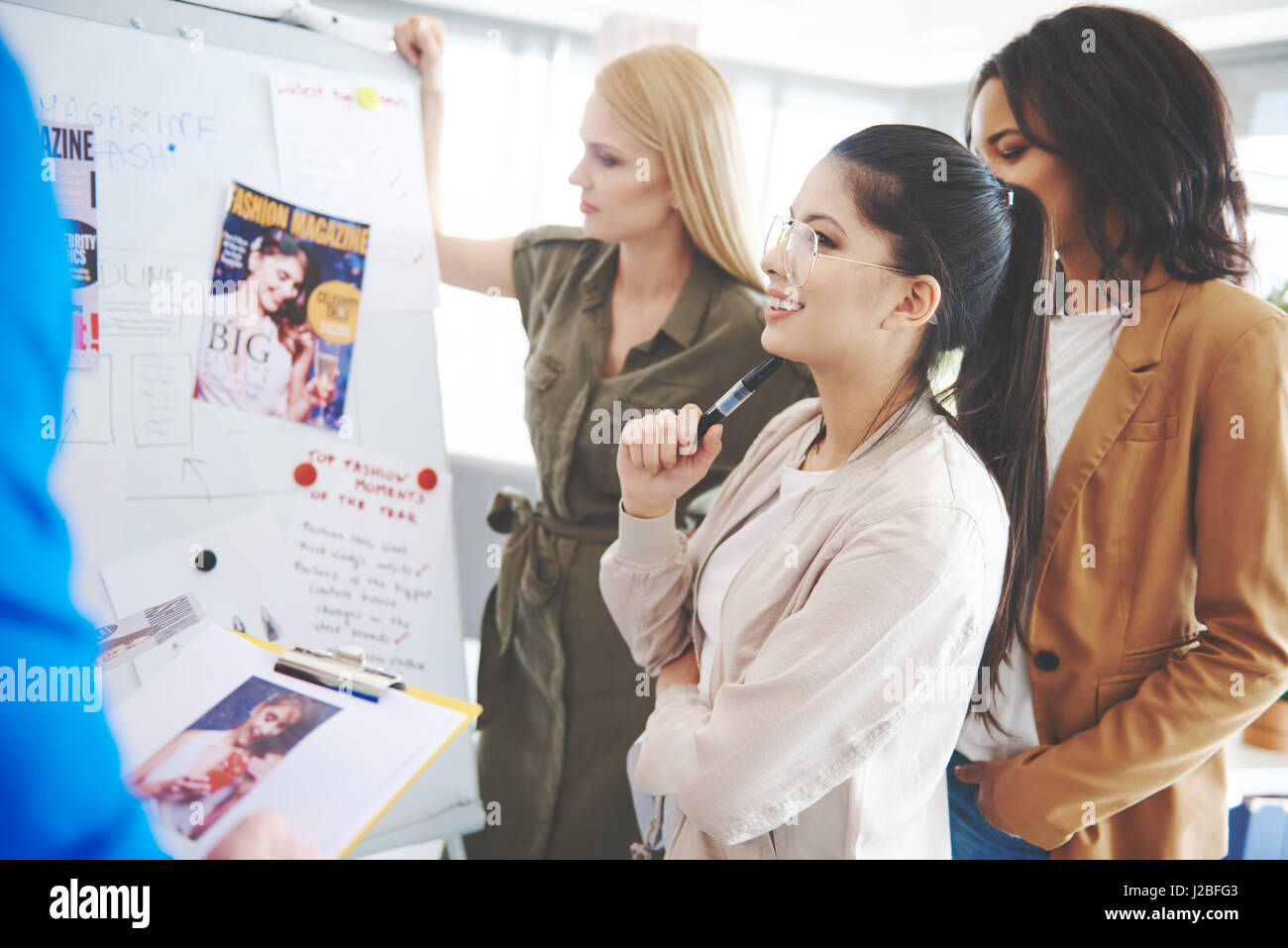 Three creative business women over work Stock Photo - Alamy