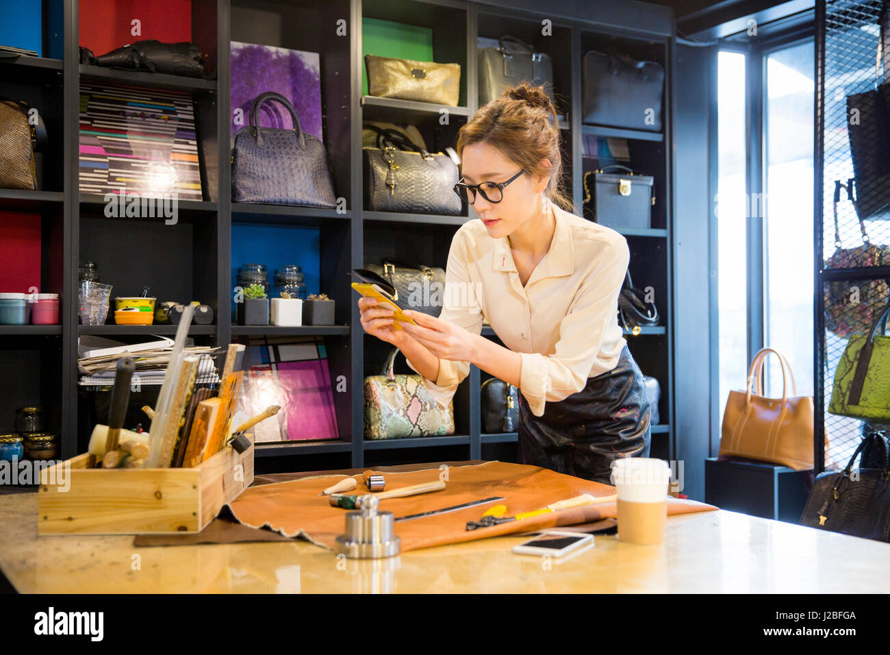 Female designer making bags Stock Photo - Alamy