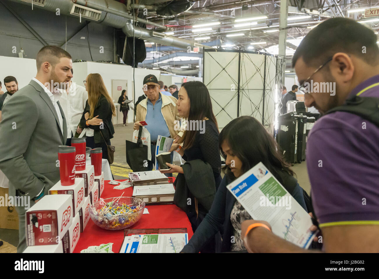 Workers from ADP speak to attendees at the TechDay New York event on Tuesday, April 18, 2017 ...