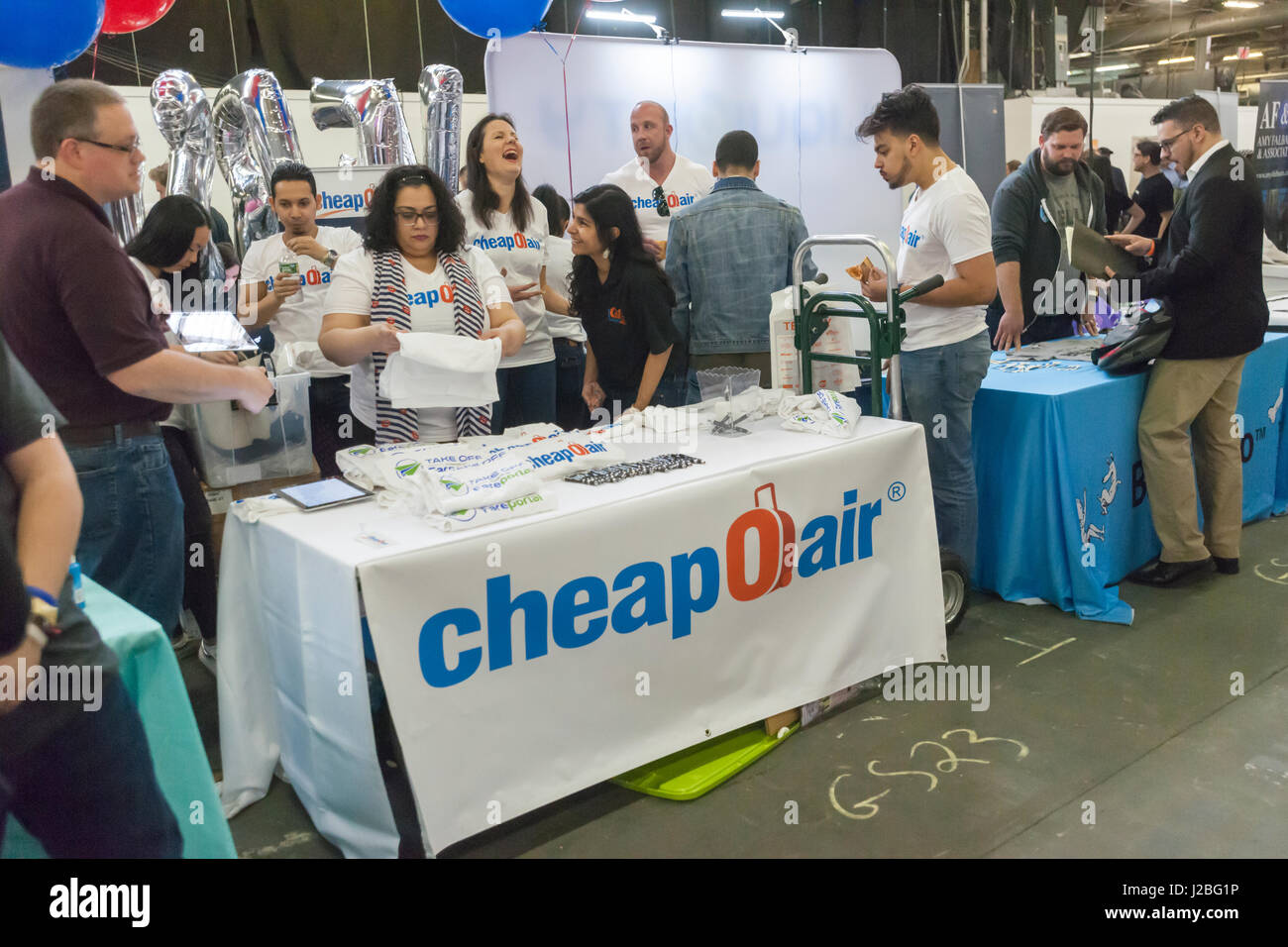 Workers from CheapOair at their table at the TechDay New York event on ...