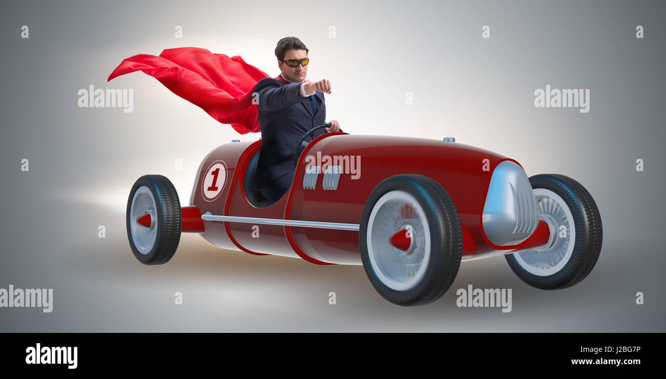Superhero businessman driving vintage roadster Stock Photo - Alamy