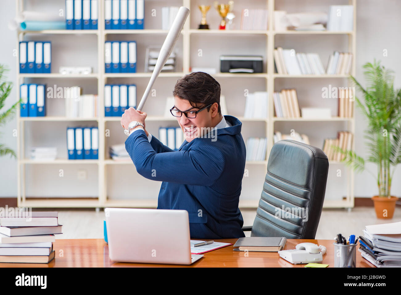 Angry aggressive businessman in the office Stock Photo - Alamy