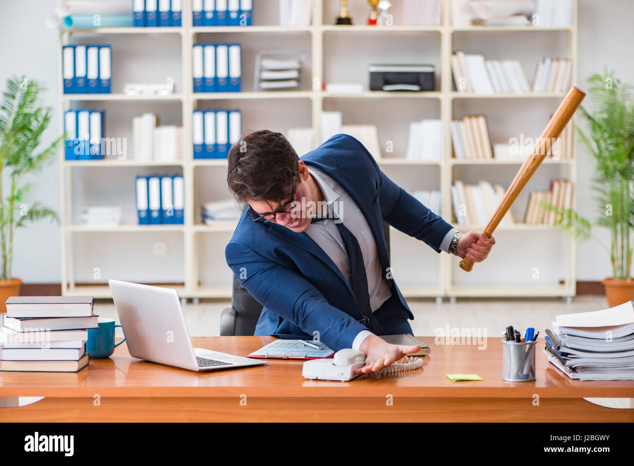 Angry aggressive businessman in the office Stock Photo - Alamy