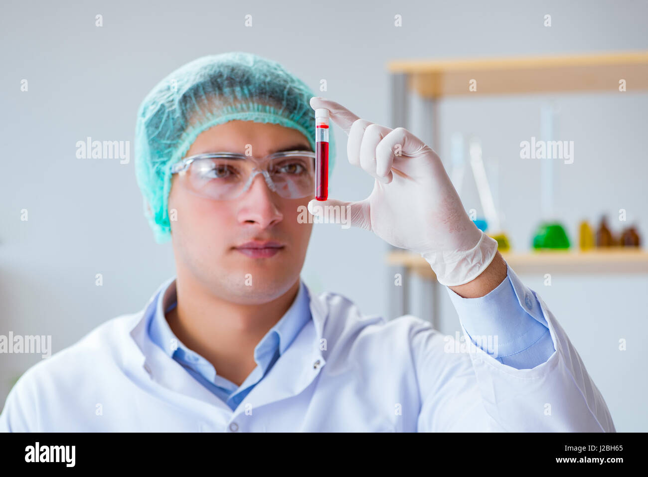 Young doctor working on blood test in lab hospital Stock Photo - Alamy