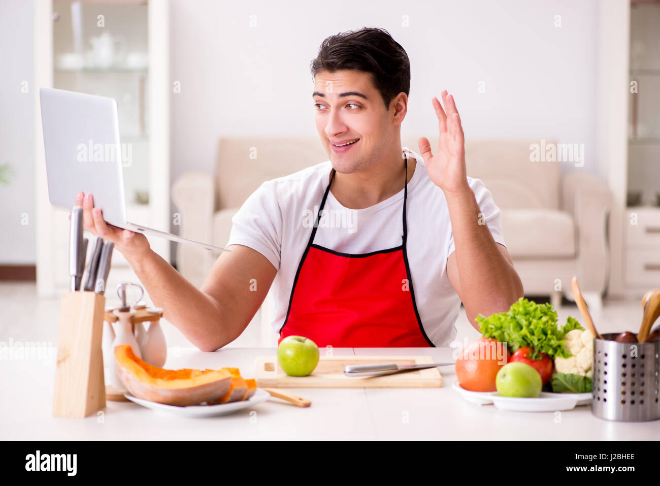 Funny man cook working in the kitchen Stock Photo - Alamy