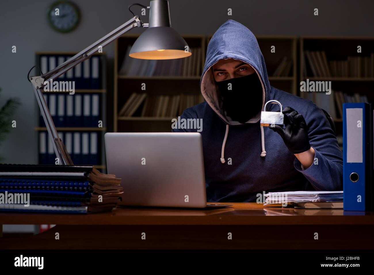 Hacker stealing personal data from home computer Stock Photo - Alamy