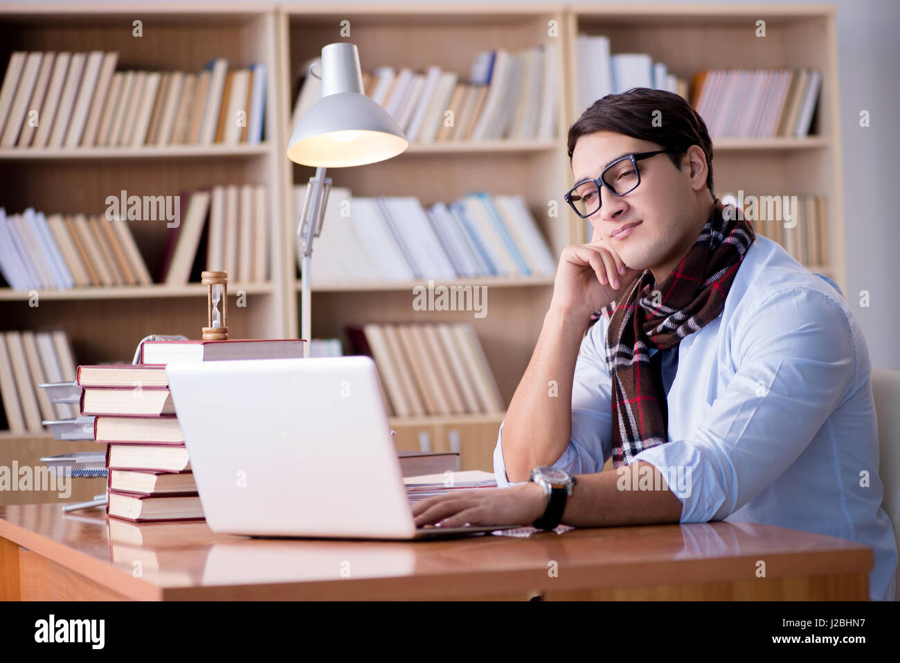 Young writer working in the library Stock Photo - Alamy