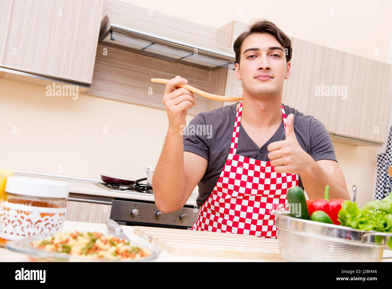 Man male cook preparing food in kitchen Stock Photo - Alamy