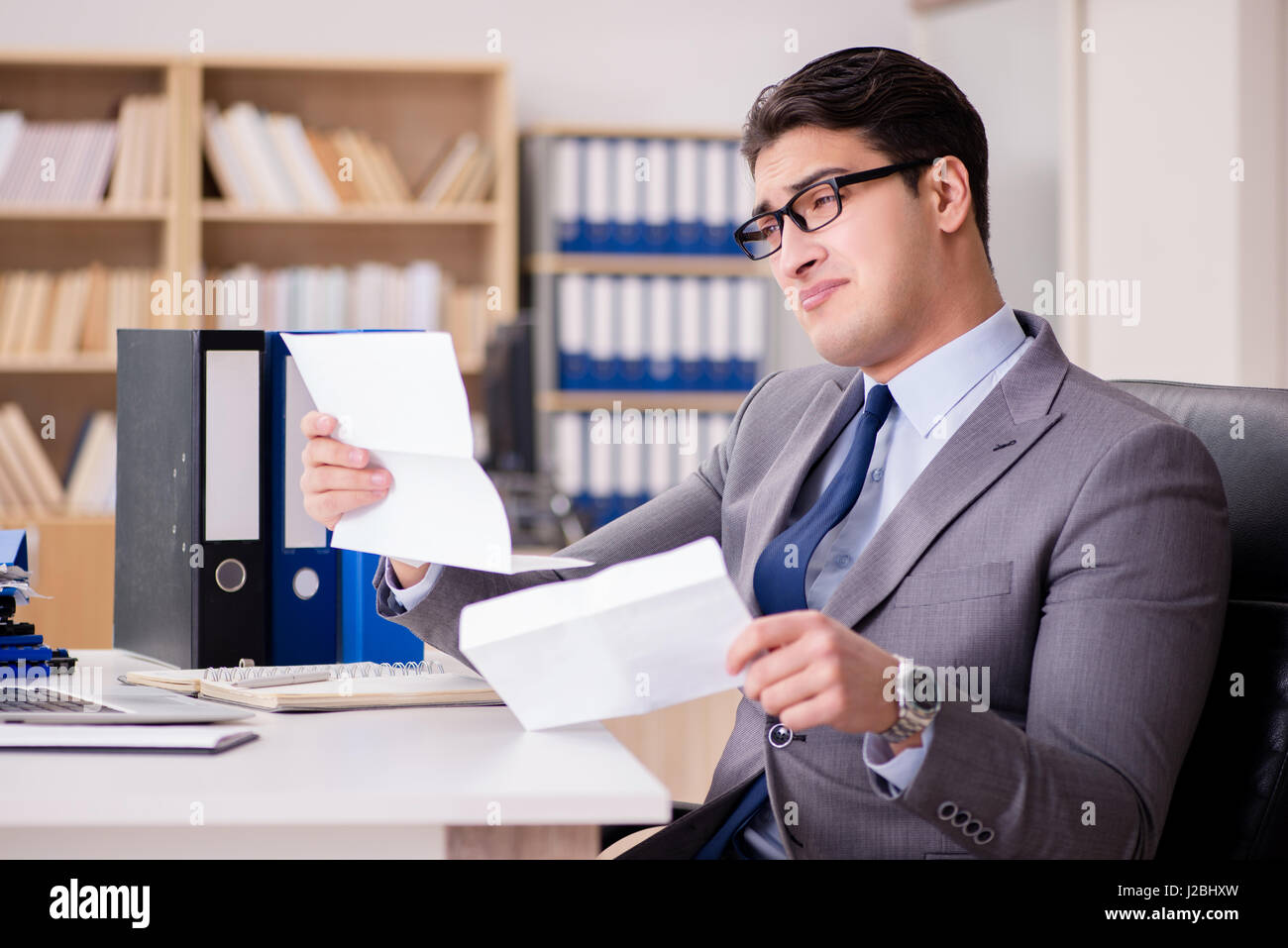 Businessman receiving letter in the office Stock Photo - Alamy