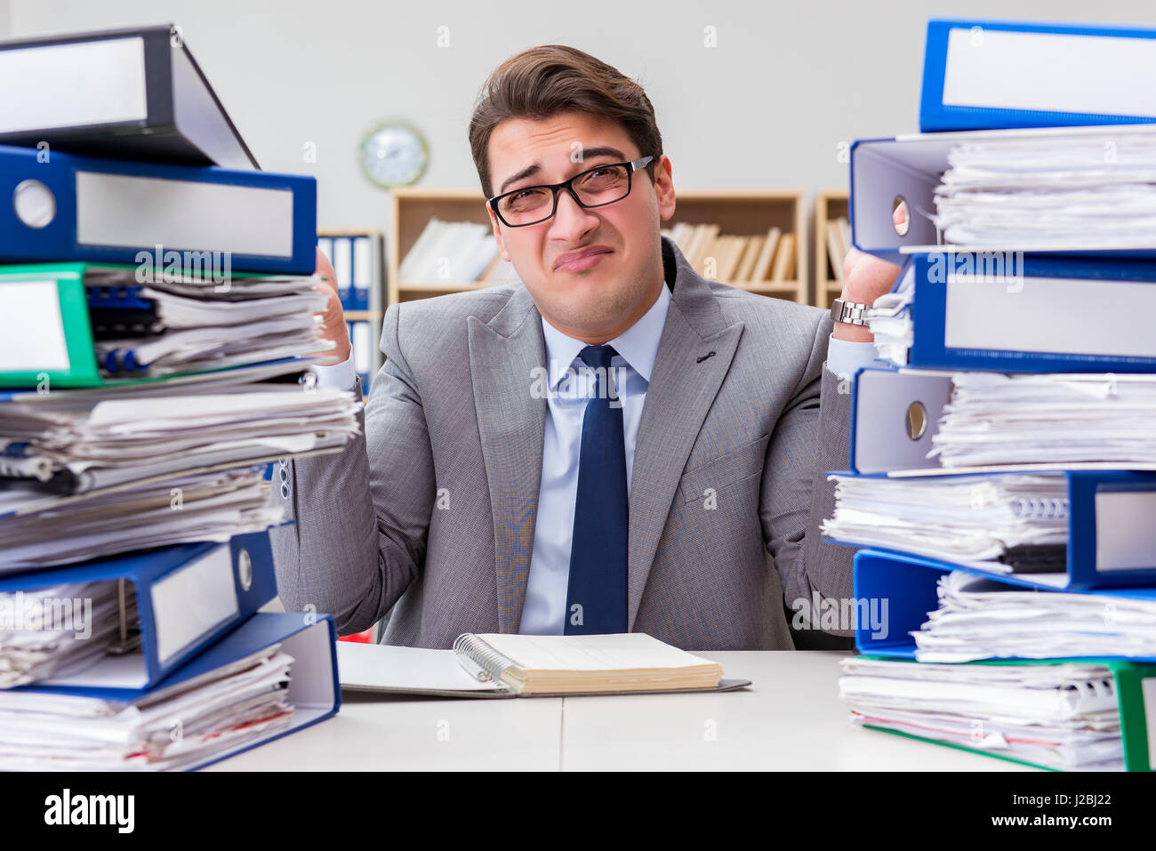 Busy businessman under stress due to excessive work Stock Photo - Alamy
