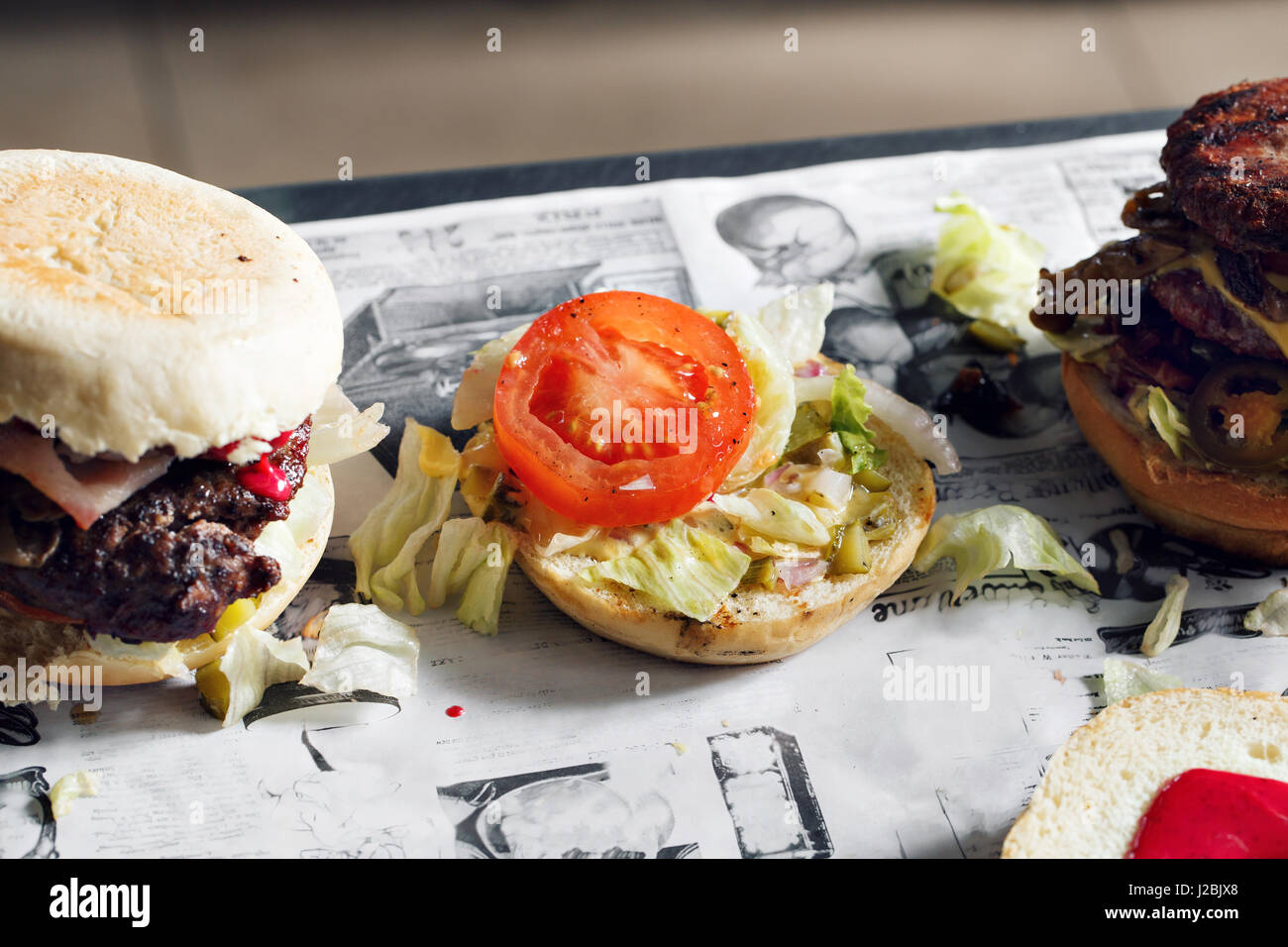 process of cooking hamburger. chef on the kitchen table making out the ...