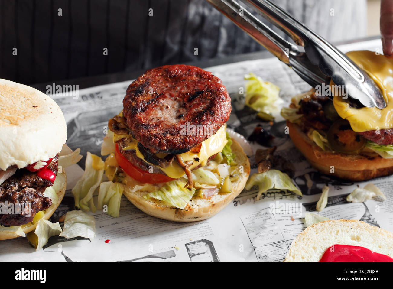 process of cooking hamburger. chef on the kitchen table making out the ...