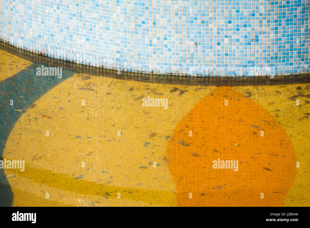 Water fountain almost empty of water and dirty with leaves and other ...