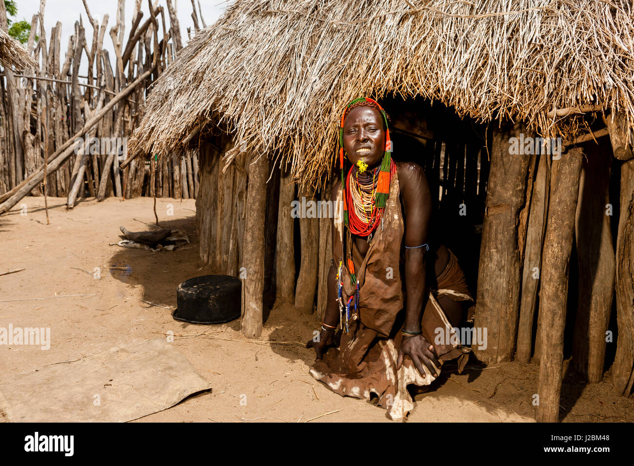 Kara woman in hut entrance. Kolcho Village. Omo Valley. Ethiopia ...