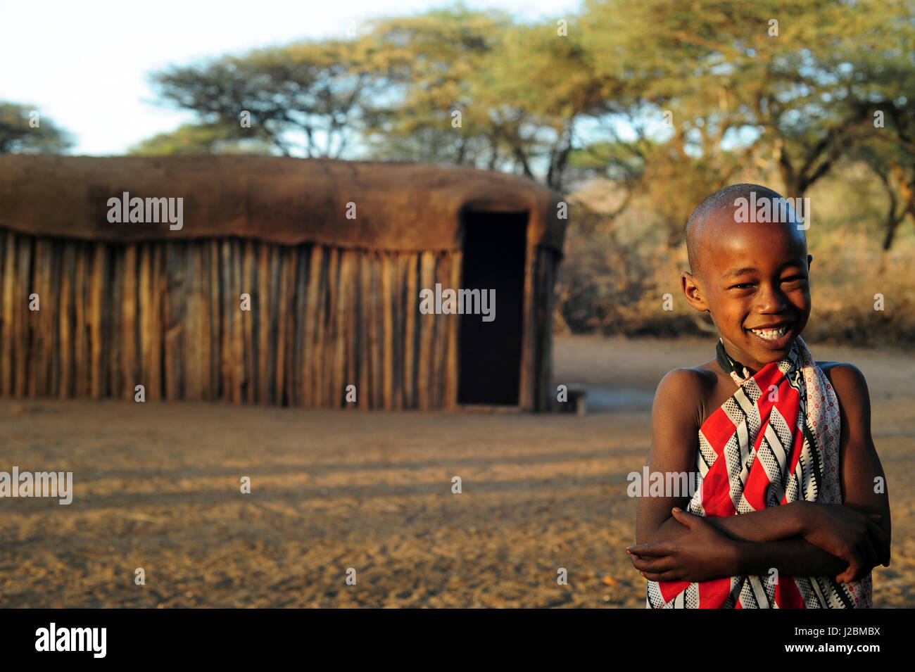 Kenya, Laikipia, Il Ngwesi, smiling girl in traditional Manyatta ...