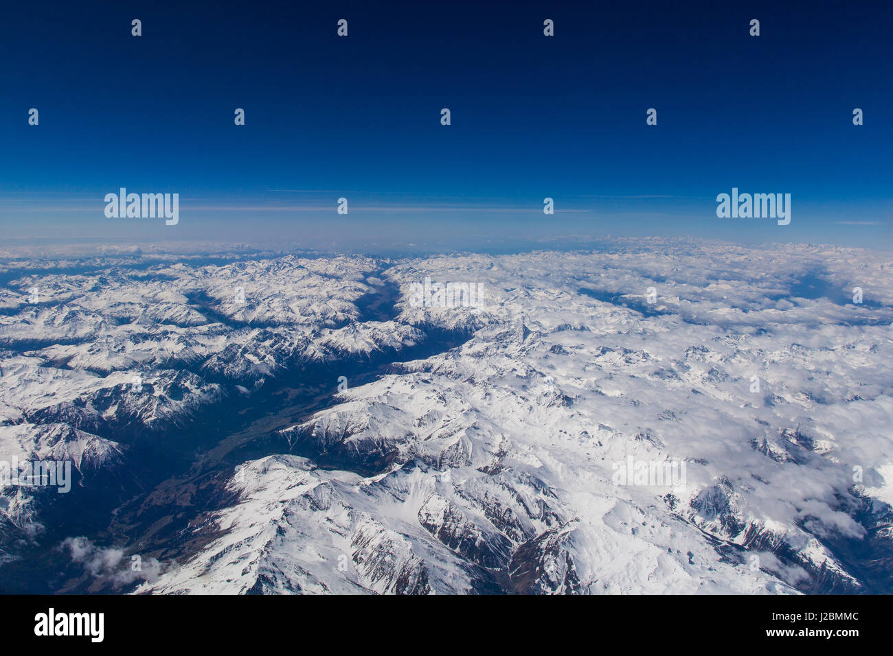 View over the alps in europe in spring in clear weather with blue skies ...
