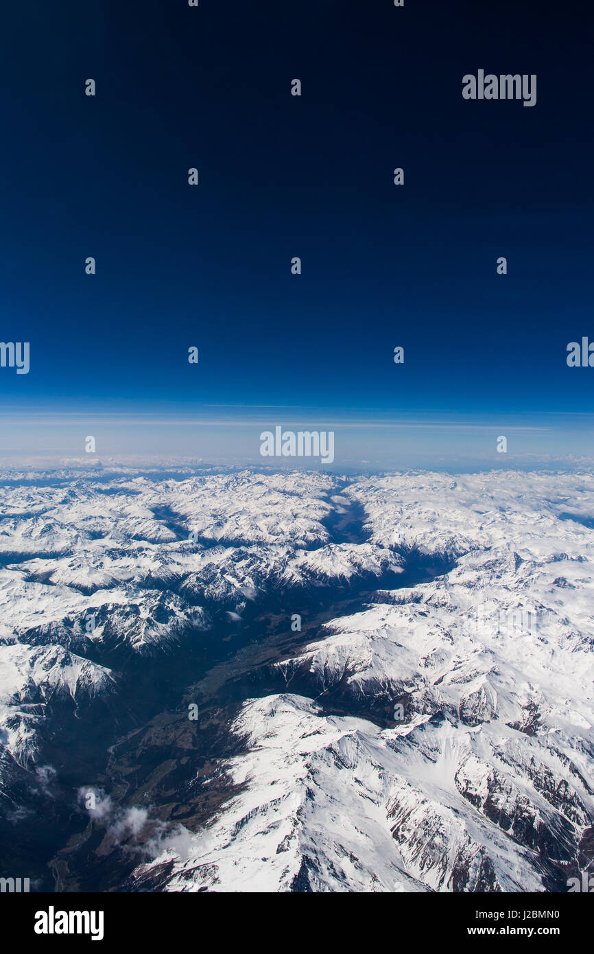 Cloudy skies over europe pictured from high altitude with deep blue ...