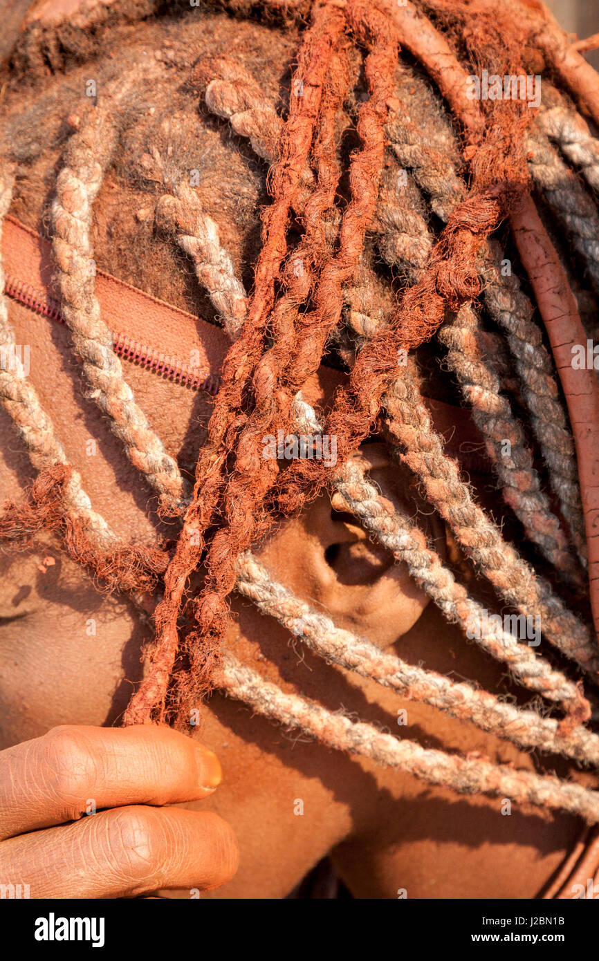 Africa, Namibia, Opuwo. Detail of Himba woman's braided hair. Credit as ...