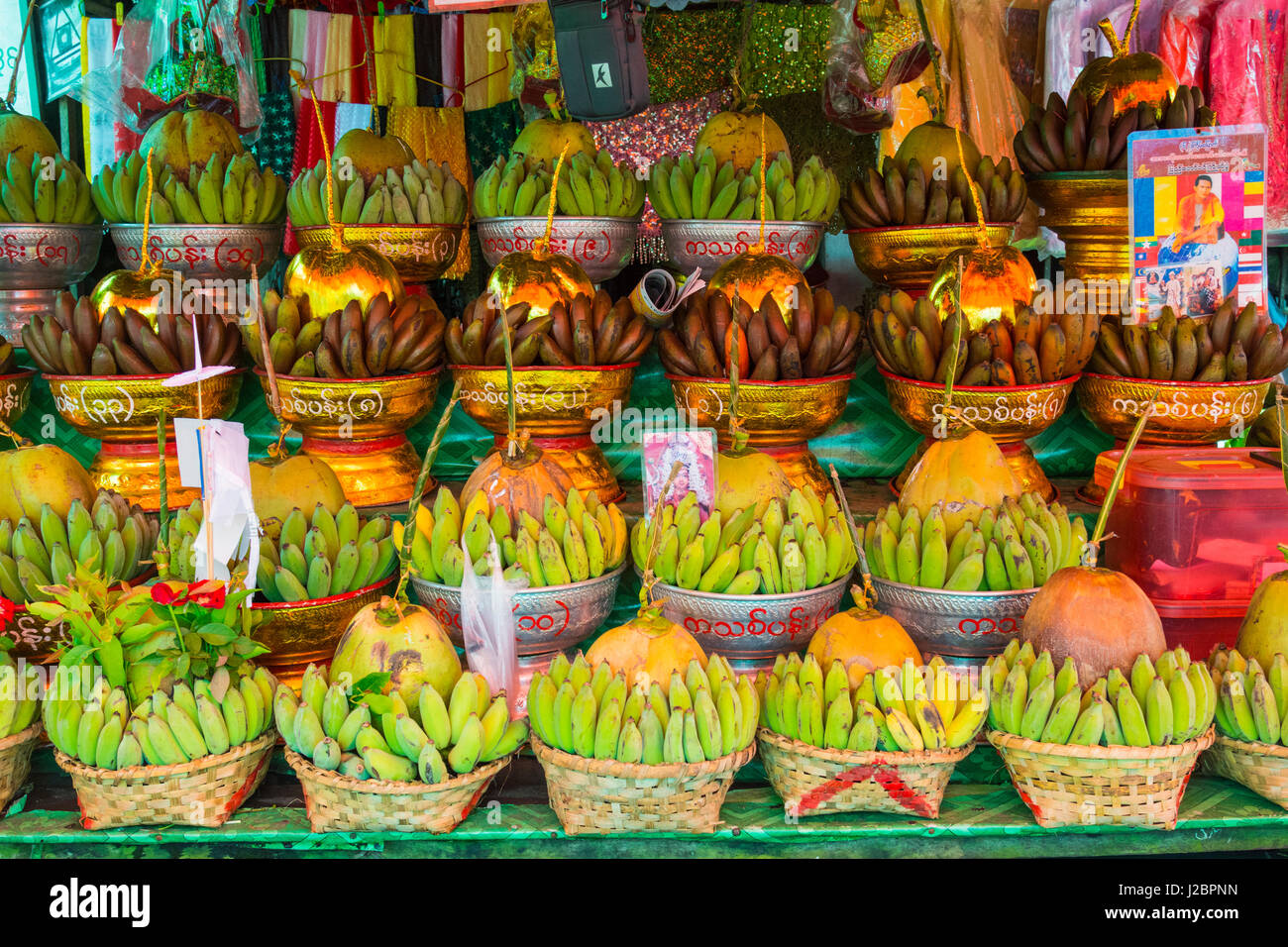 Myanmar. Yangon. Botataung Pagoda. Offerings for sale on the road next ...