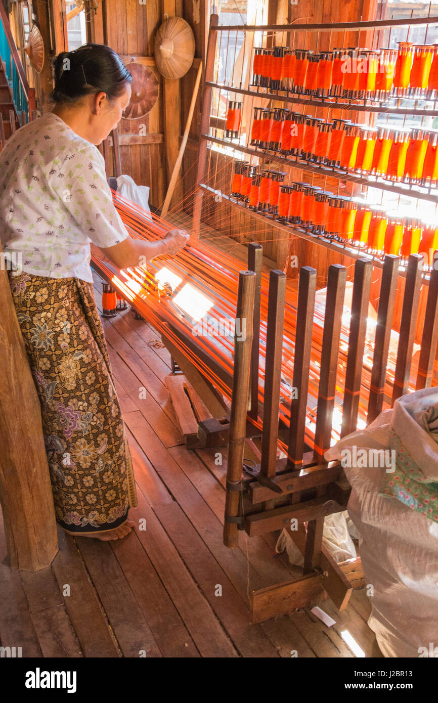 Myanmar. Shan State. Inle Lake. Ko Than Hlaing silk and lotus weaving center. Woman weaving silk ...