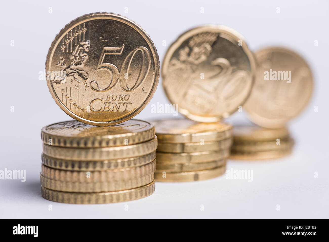 golden euro coins lined up Stock Photo - Alamy