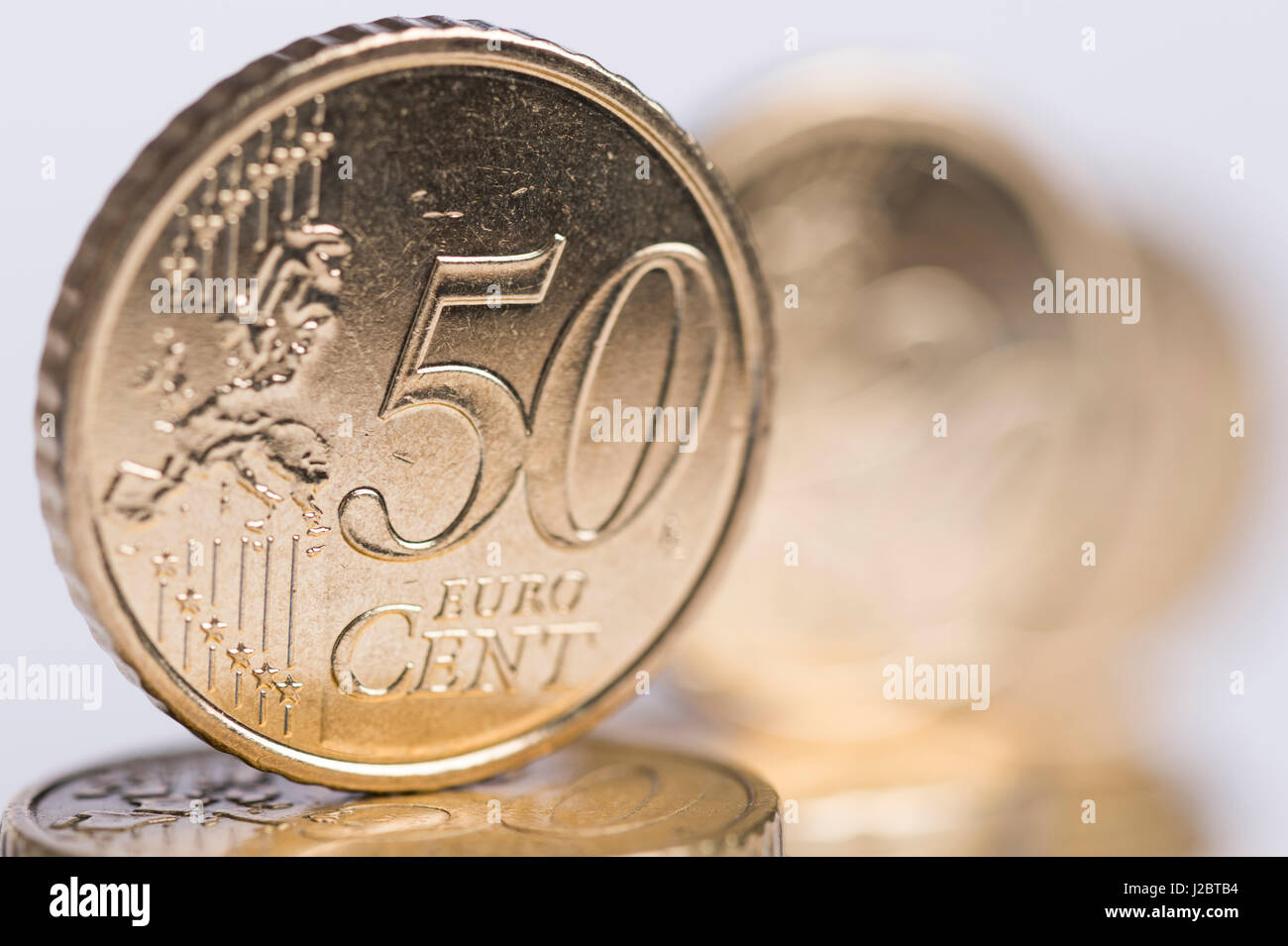 golden euro coins lined up Stock Photo - Alamy