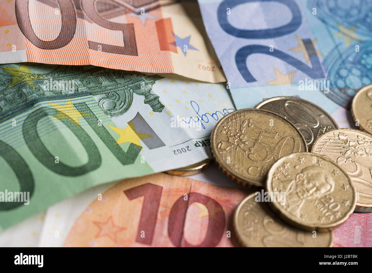Saving euro coins and notes Stock Photo - Alamy