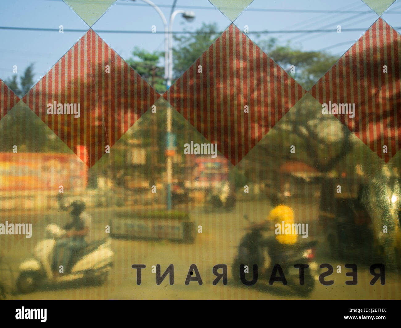 Street scene through restaurant glass door, Cochin, Kerala, India Stock ...