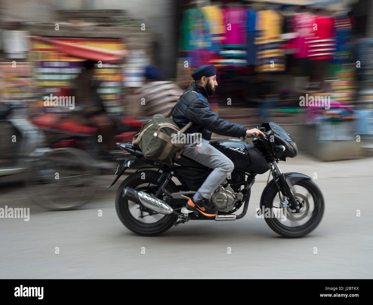Man riding motorbike in Amritsar, Punjab, India Stock Photo - Alamy