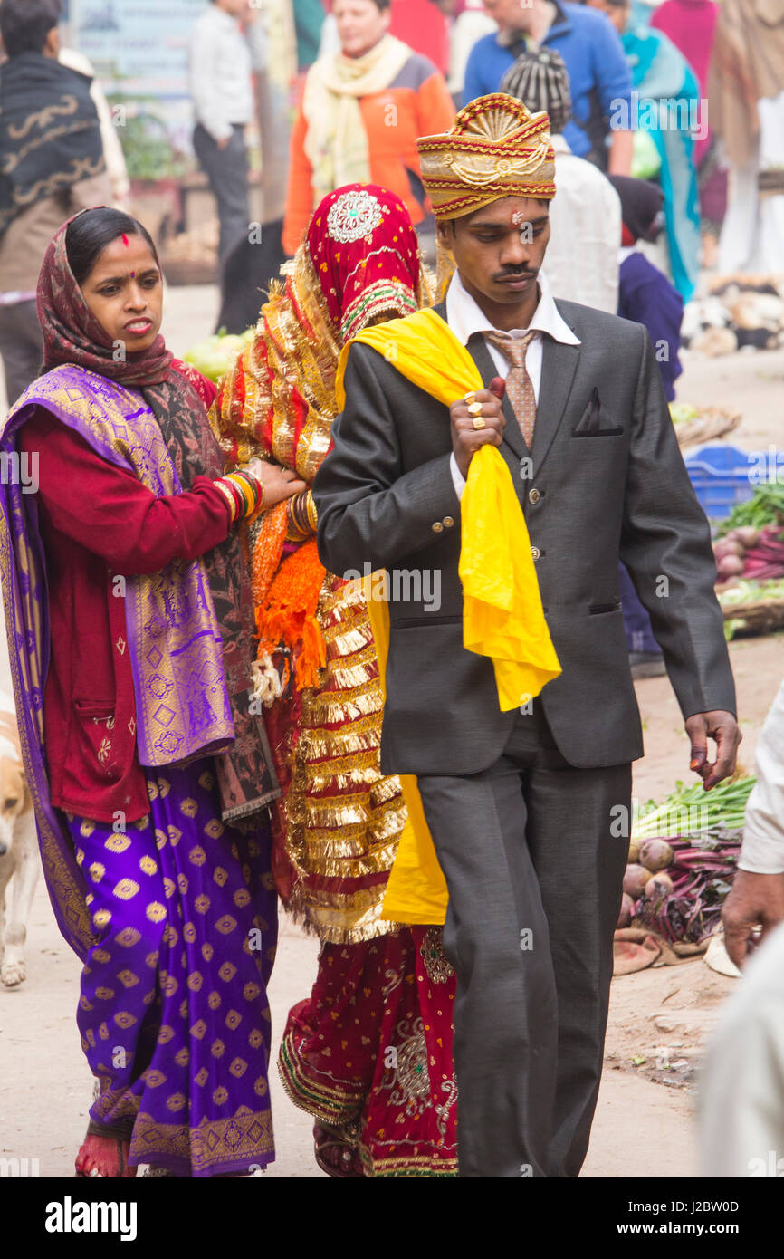 India, Uttar Pradesh, Varanasi. Wedding party walks through the streets ...