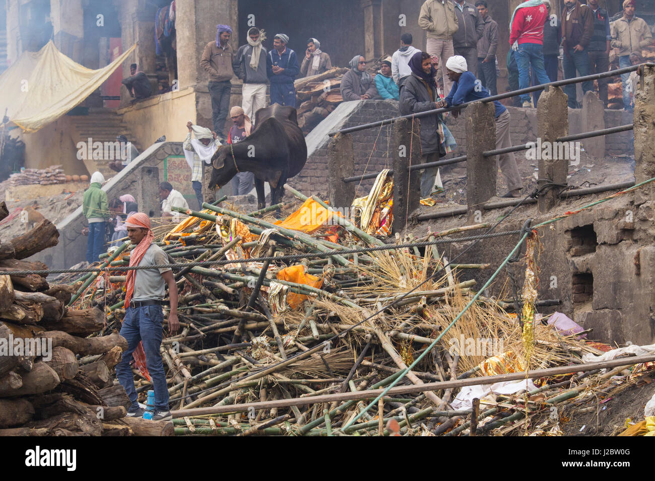 India, Uttar Pradesh, Varanasi. Cremation pyre along the Ganges River ...