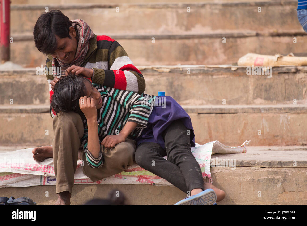 India, Uttar Pradesh, Varanasi. Personal hygiene along the banks of the ...