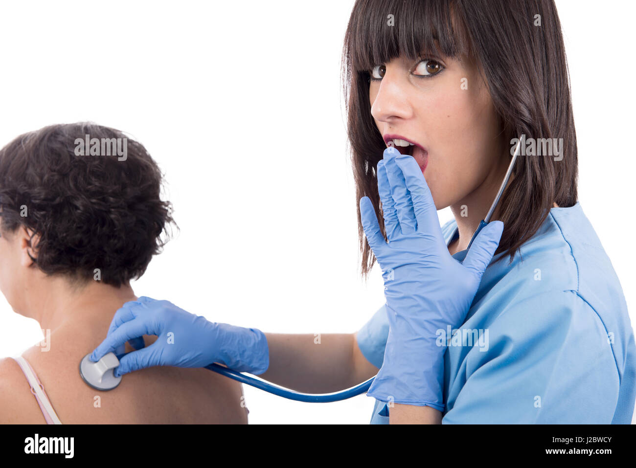 young female doctor examines a patient with a stethoscope Stock Photo ...