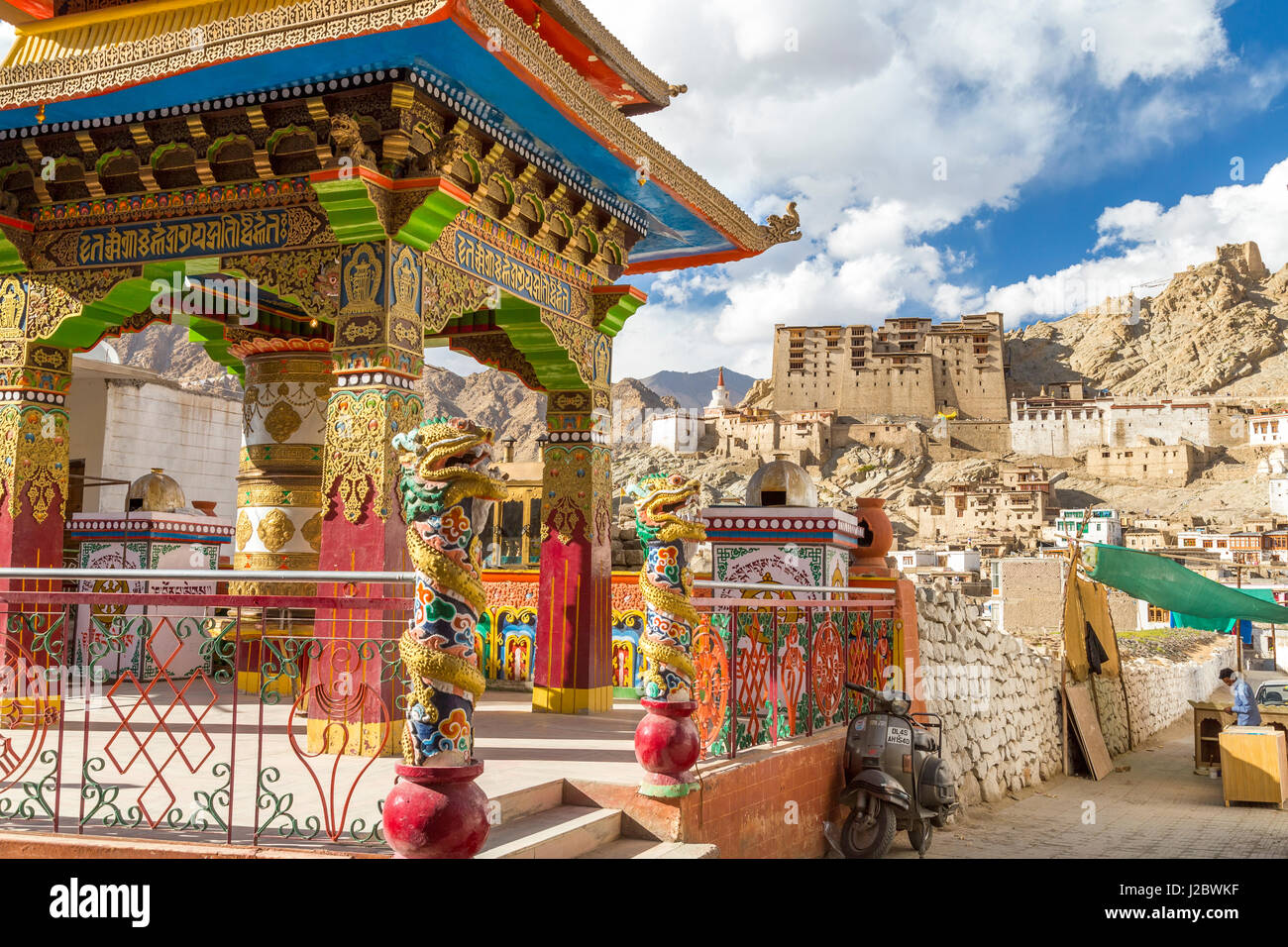 Prayer wheel and Leh Palace in background, Leh, Ladakh, India Stock ...