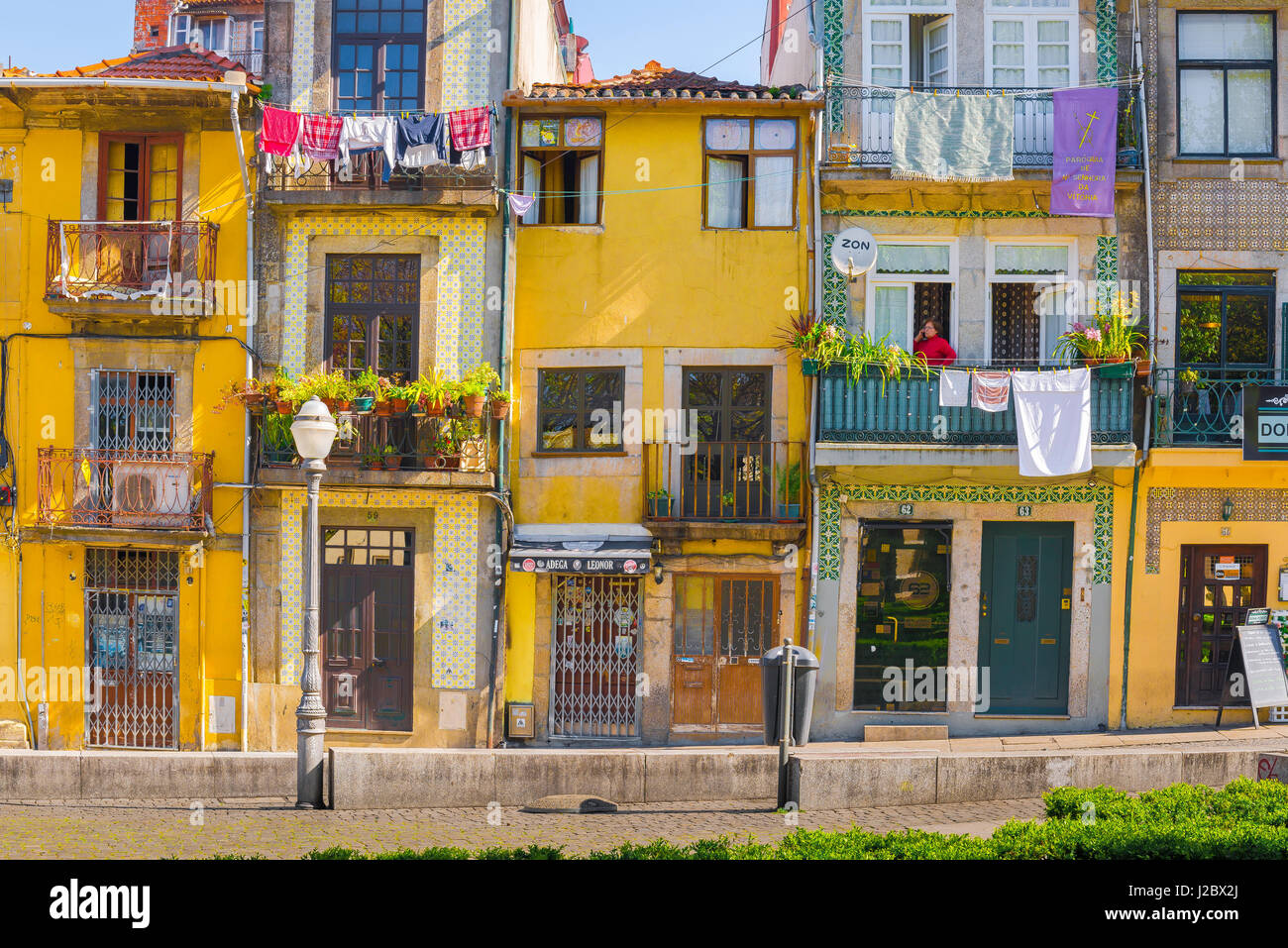 Portugal city street, view of a row of colorful houses in a street near ...