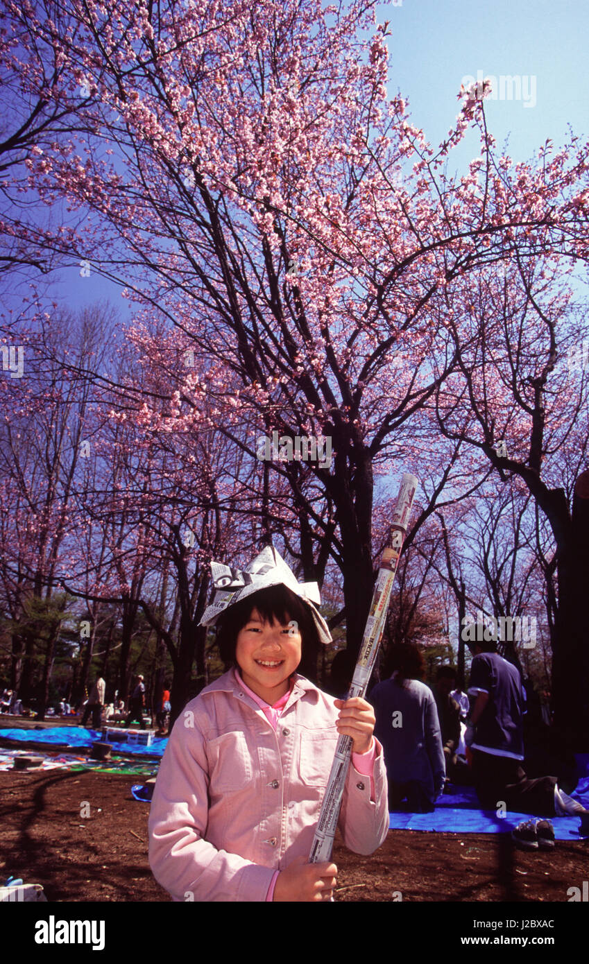 Young girl posing with her newspaper helmet 'kabuto' and sword, a ...